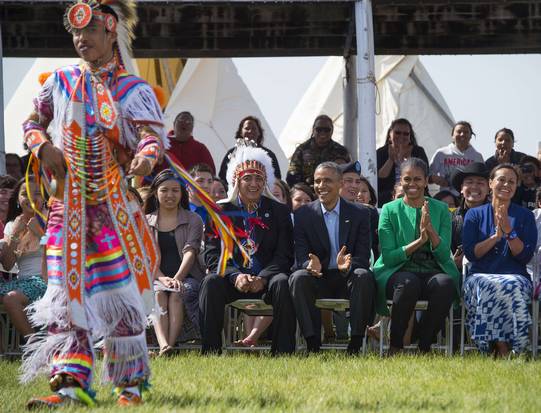 Barack Obama and first lady Michelle Obama sit with Chairman of the ...